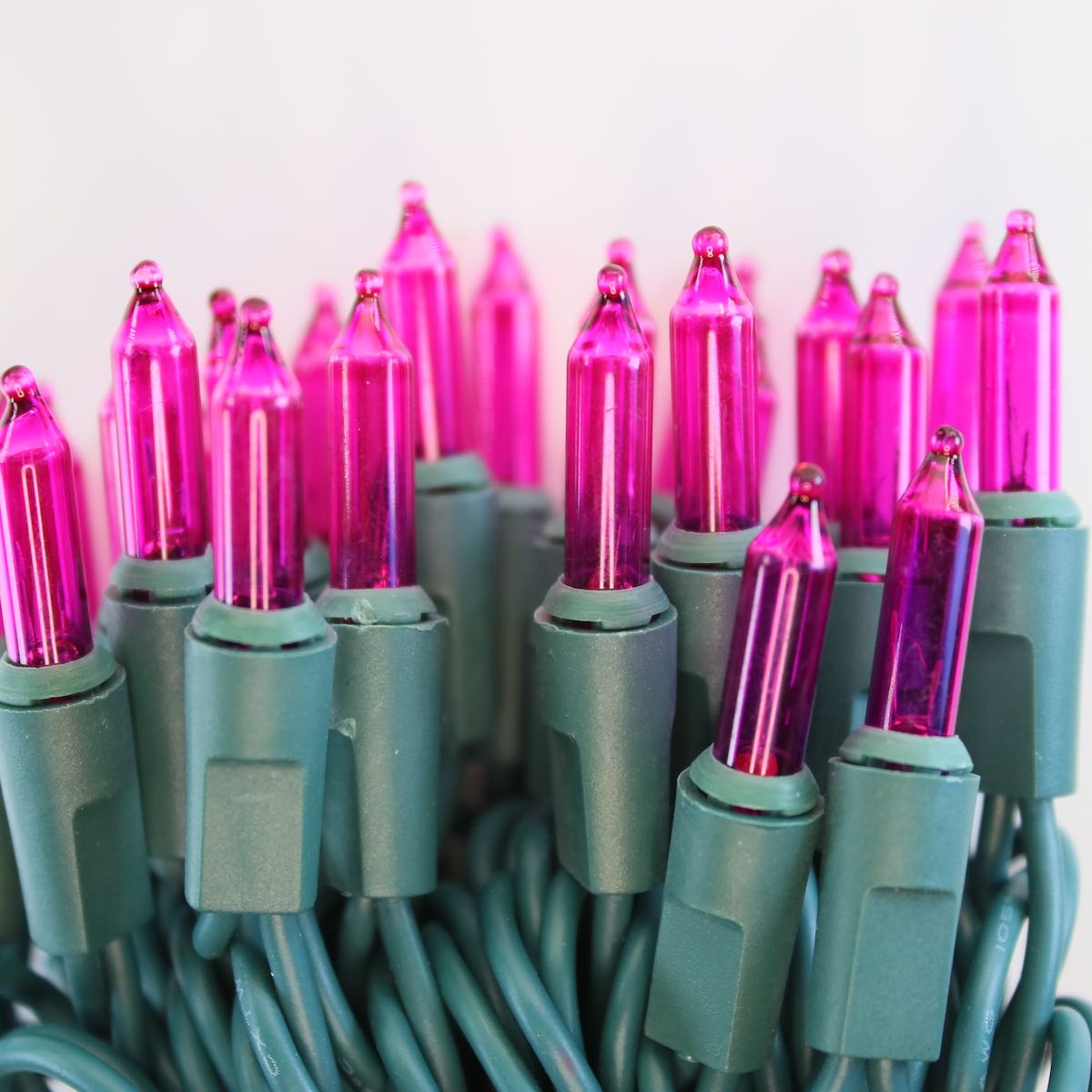 50-bulb Pink Mini Lights, 6" Spacing, Green Wire – Christmas Light Source